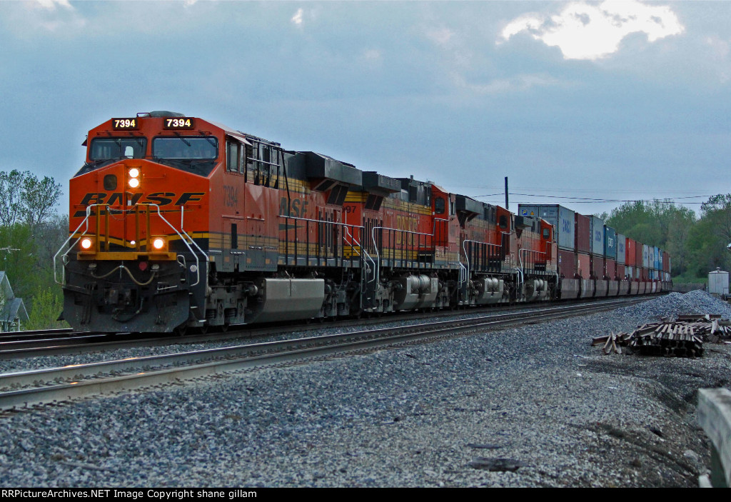 BNSF 7394 Leads a stack EB into last light.